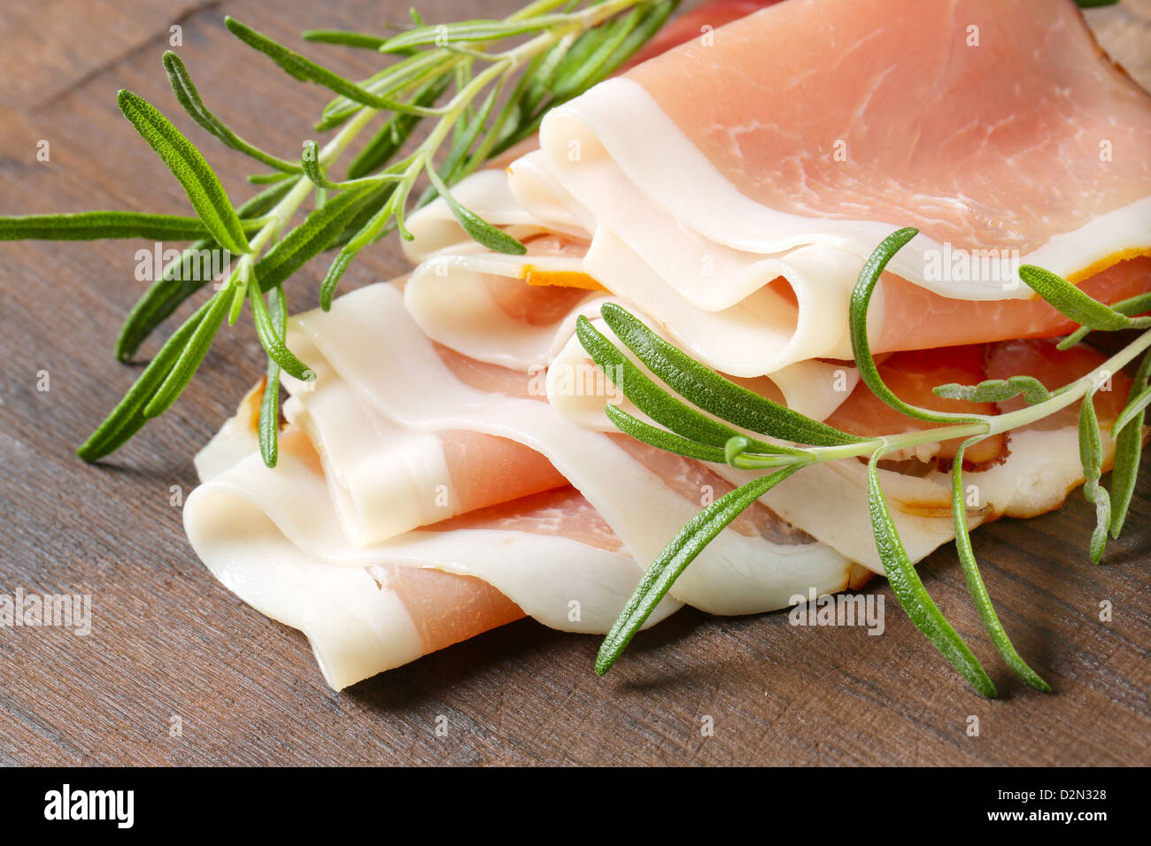 Delicious dry-cured ham sliced paper thin Stock Photo - Alamy