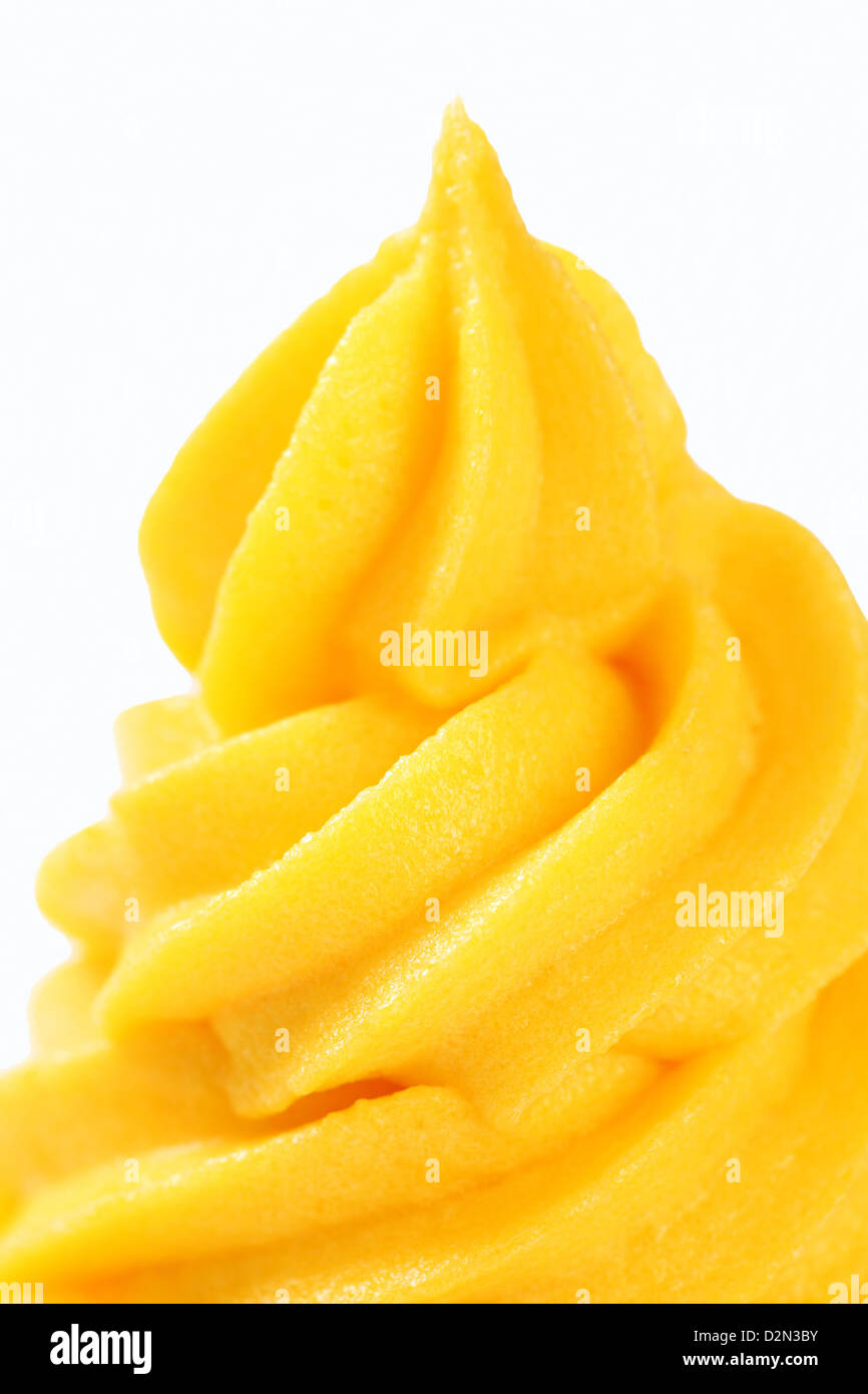 Swirl of yellow cream - detail Stock Photo - Alamy