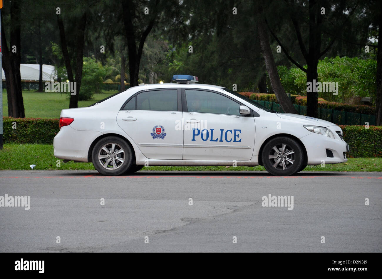 A Singapore police patrol car parked near a police check post at ...