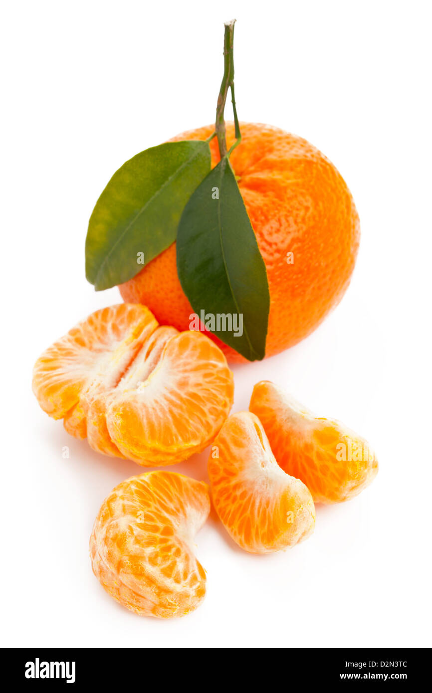 Organic mandarin whole and slices on white background Stock Photo - Alamy