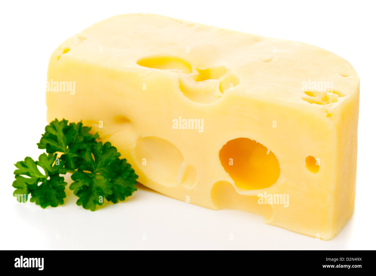 Piece of fresh edam cheese with parsley on white background Stock Photo ...