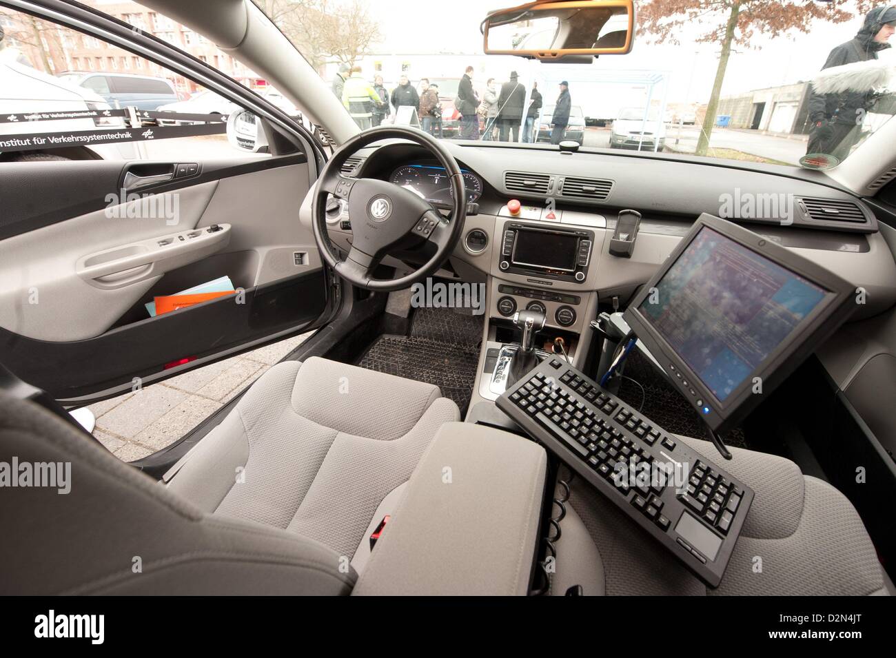 The driver's seat of a test vehichle parks without a driver at the ...