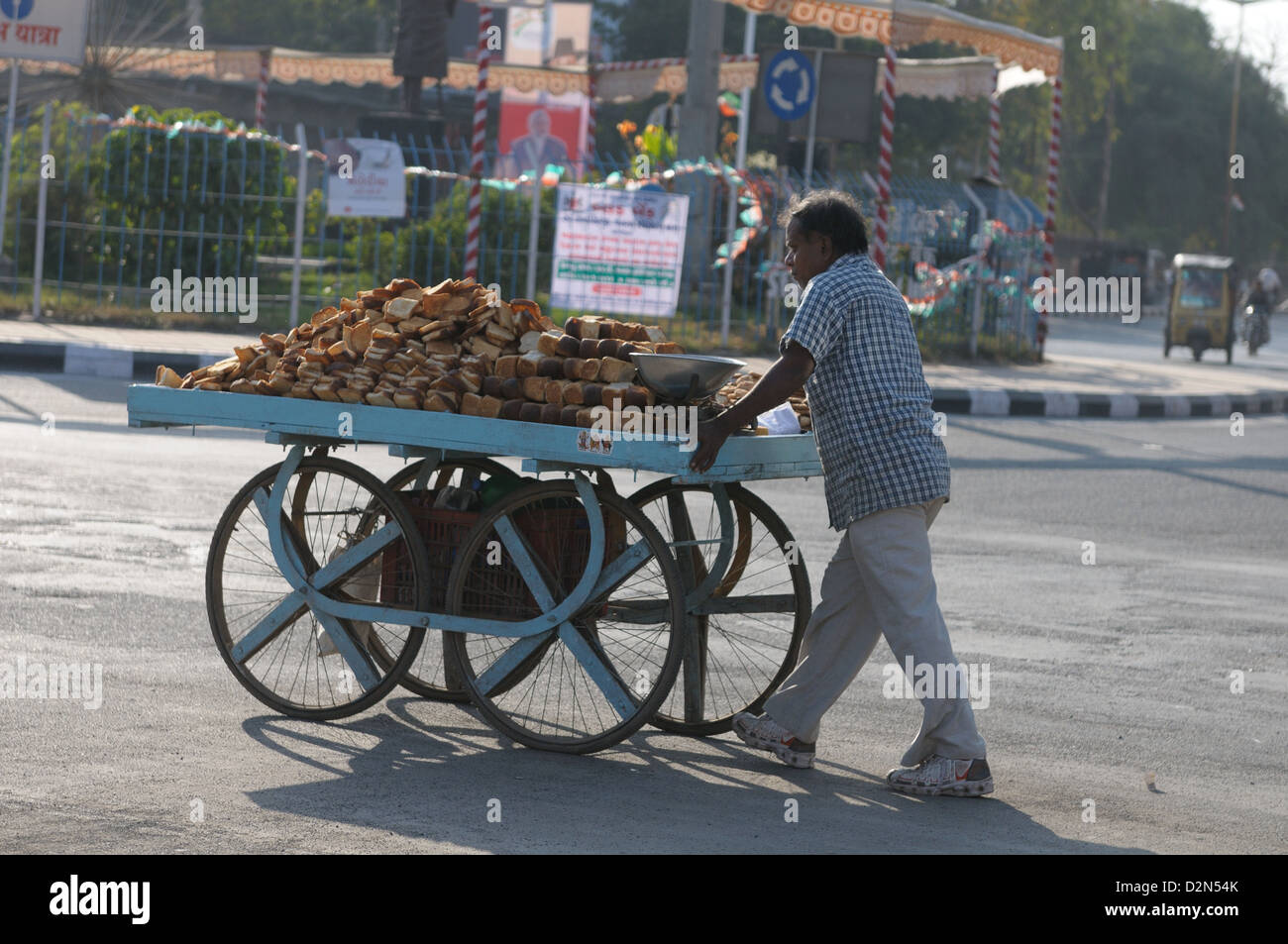 Selling varieties of bread on a push cart, Gujarat, India, Asia Stock ...