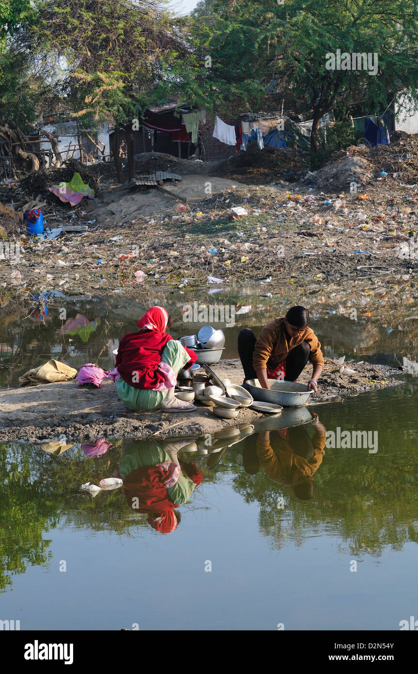 Washing vessels in the backyard of the house, Gujarat, India, Asia ...