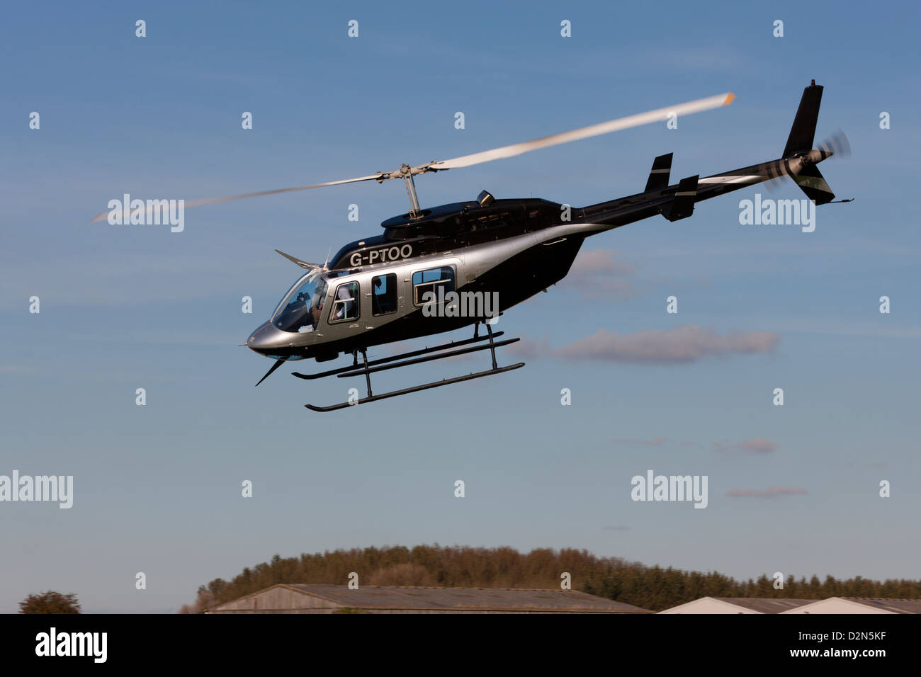 Bell 206L-4 Longranger IV G-PTOO in flight taking-off from Breighton ...