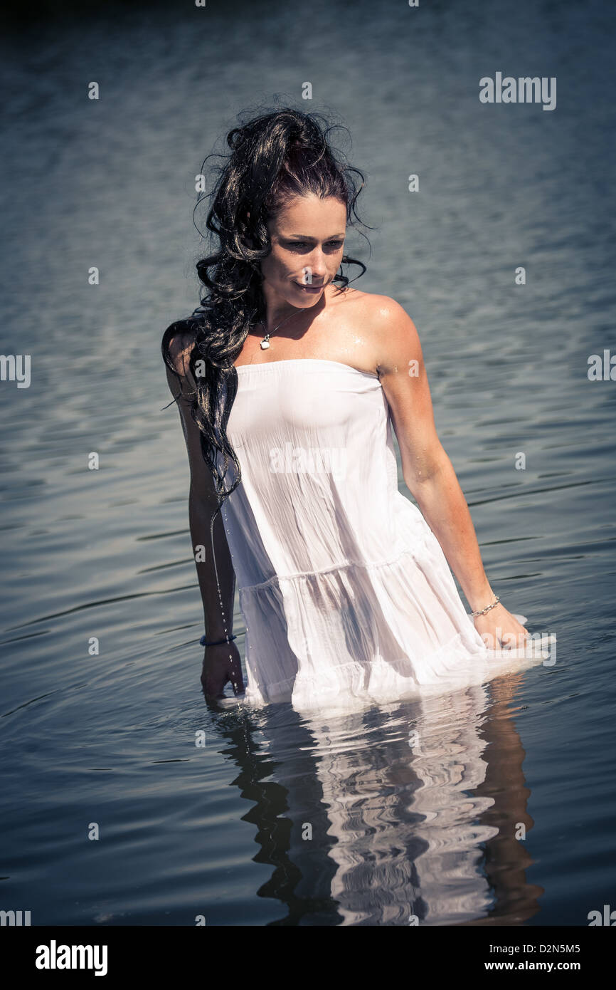 an outdoor portrait of a young woman in the water Stock Photo - Alamy