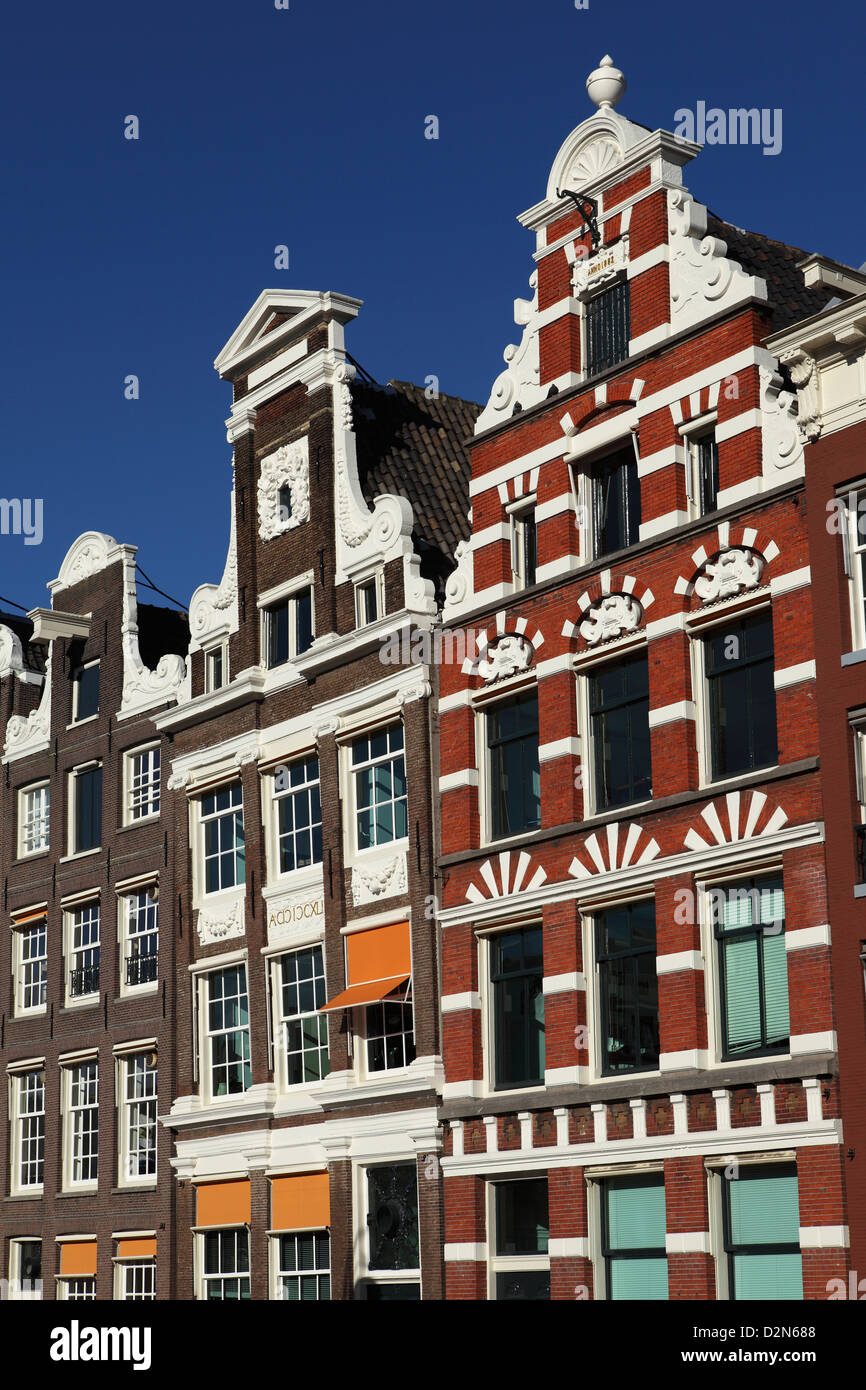 Traditional facades of Dutch townhouses in Amsterdam, The Netherlands ...