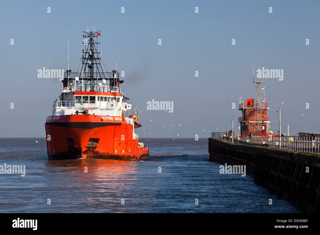The offshore supply ship Putford Savior entering Yarmouth harbour Stock ...
