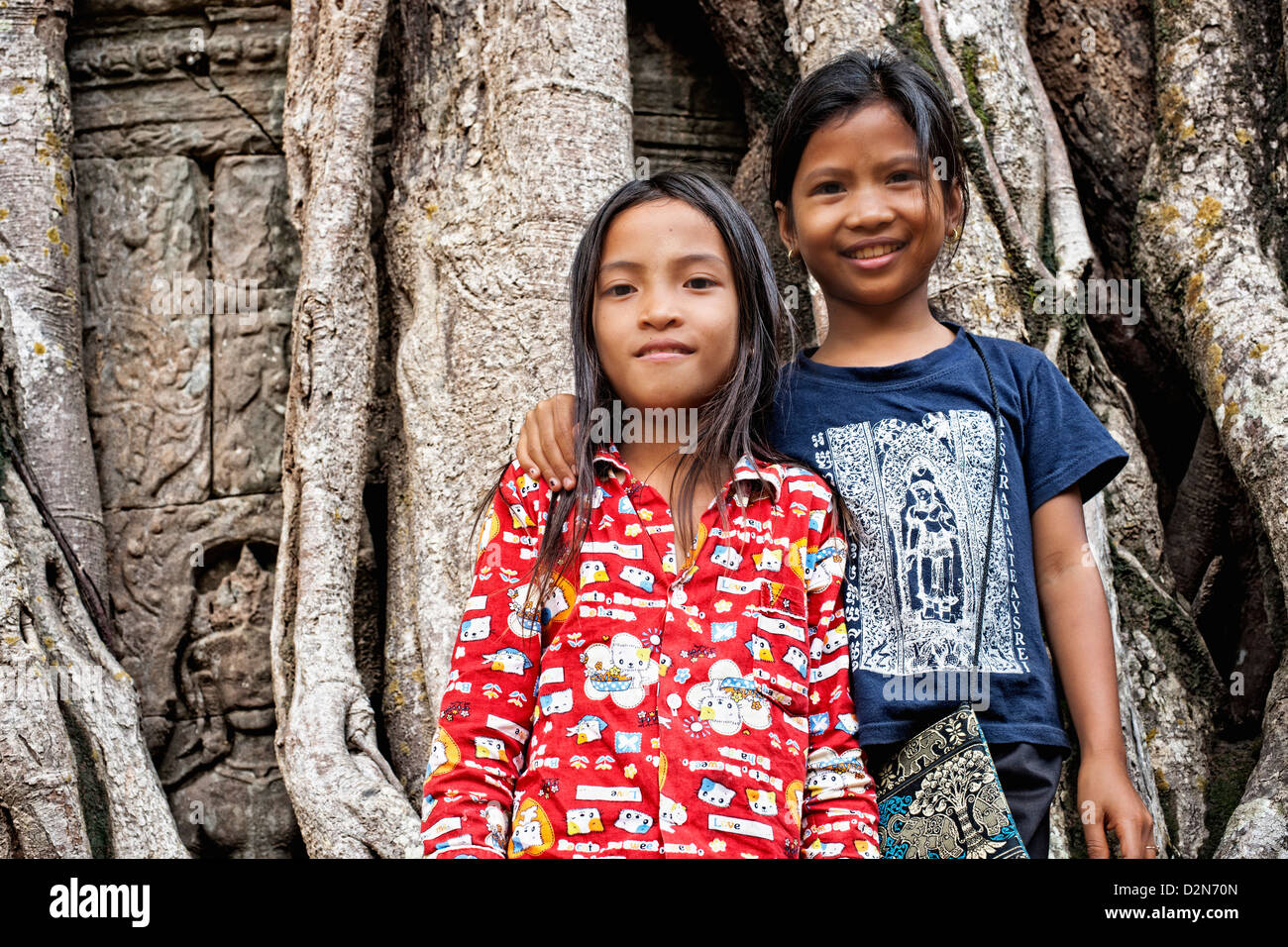 Ta Som, (entrance gate) and two local girls, Angkor, Siem Reap ...