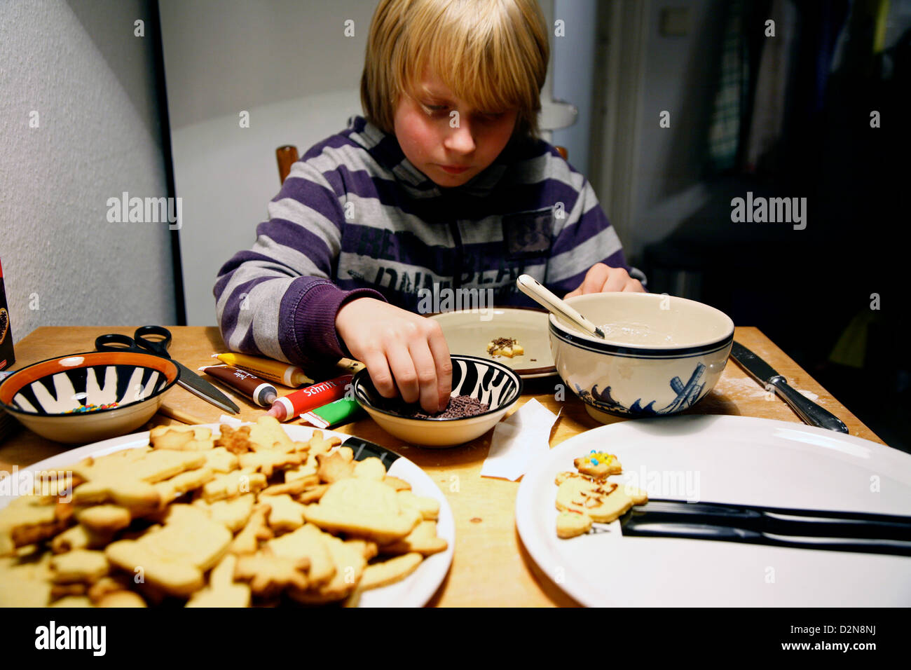 Boy bakes cookies Stock Photo - Alamy