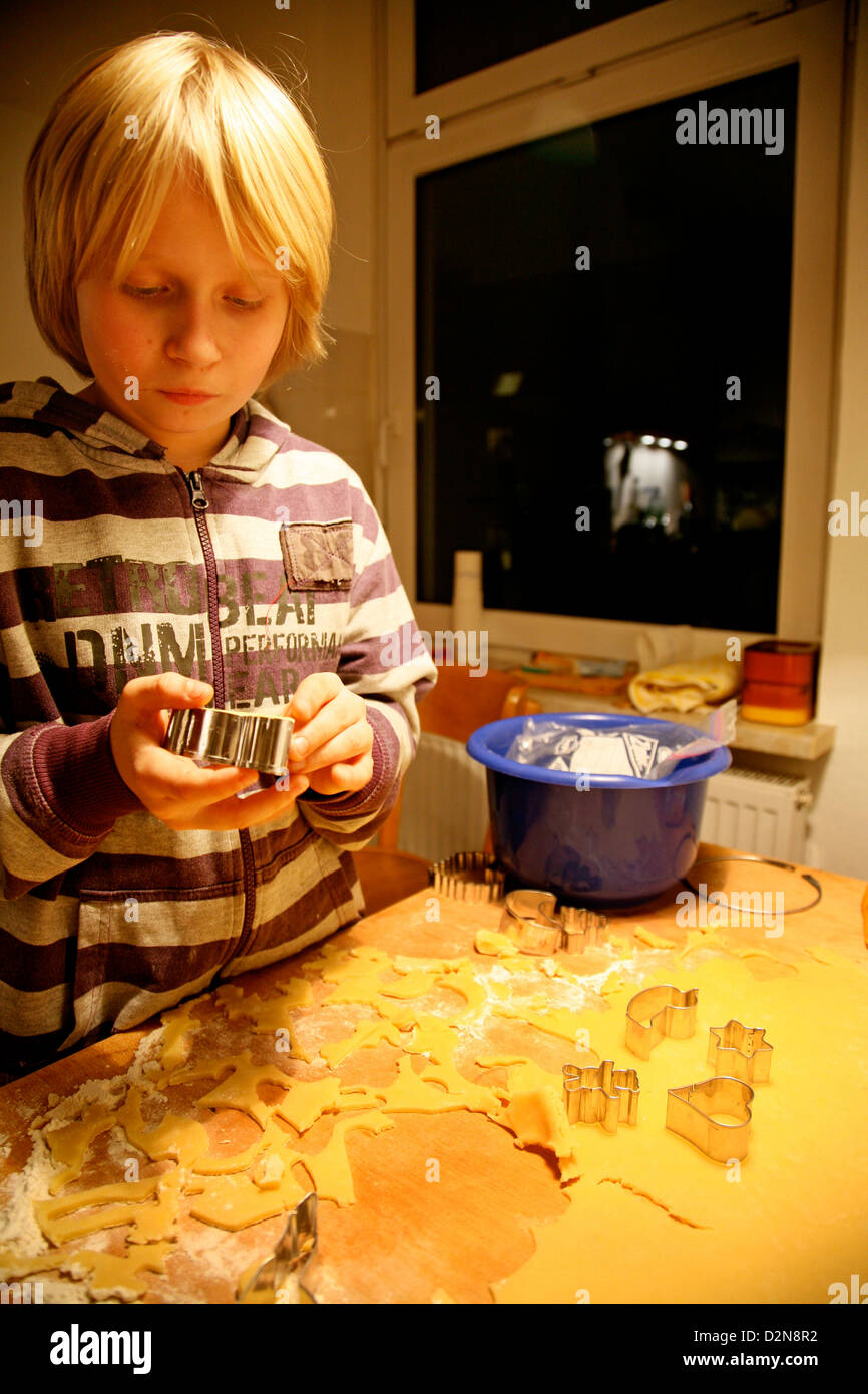 Boy bakes cookies Stock Photo - Alamy