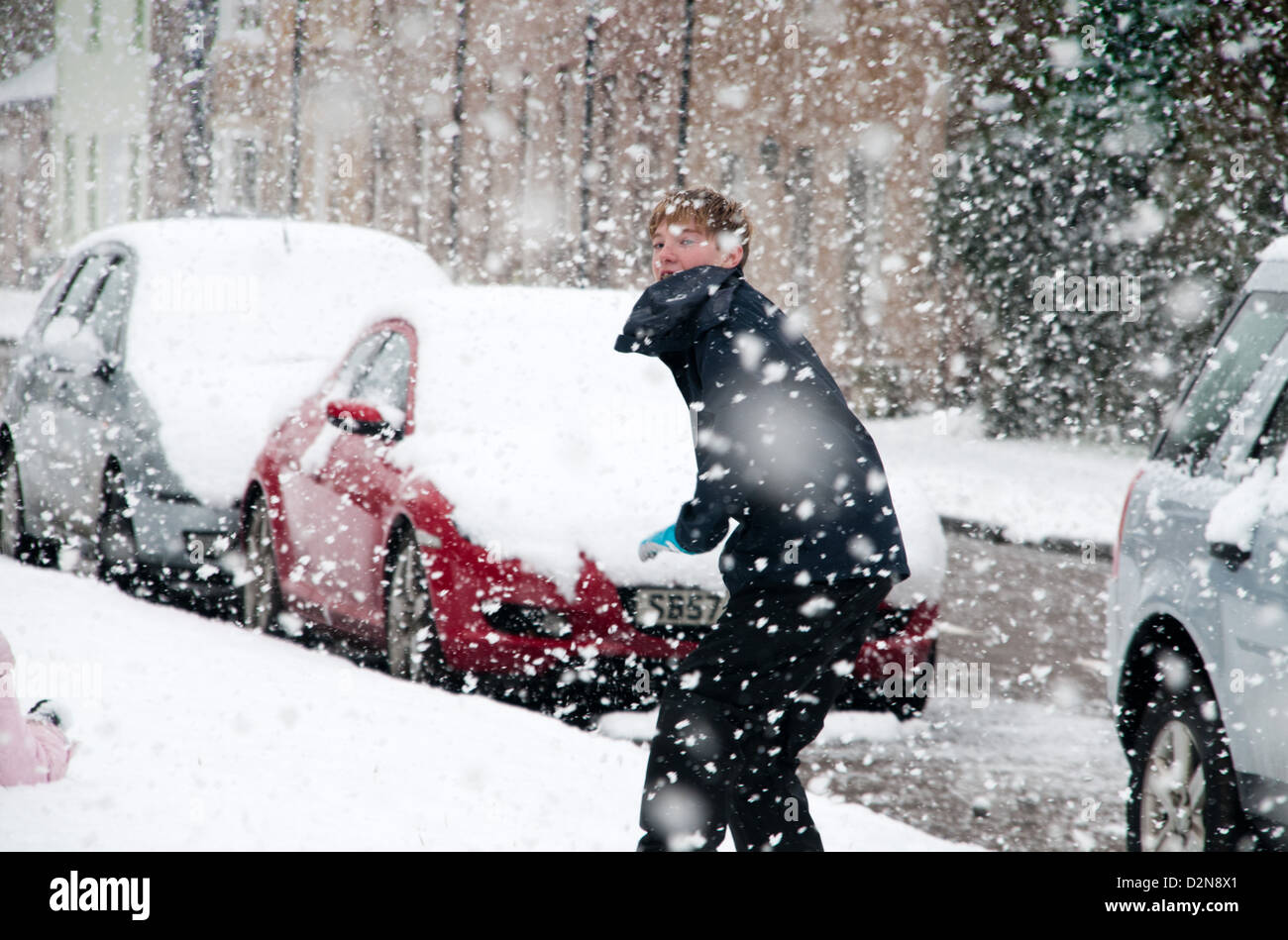 Boy about to throw a snowball Stock Photo - Alamy