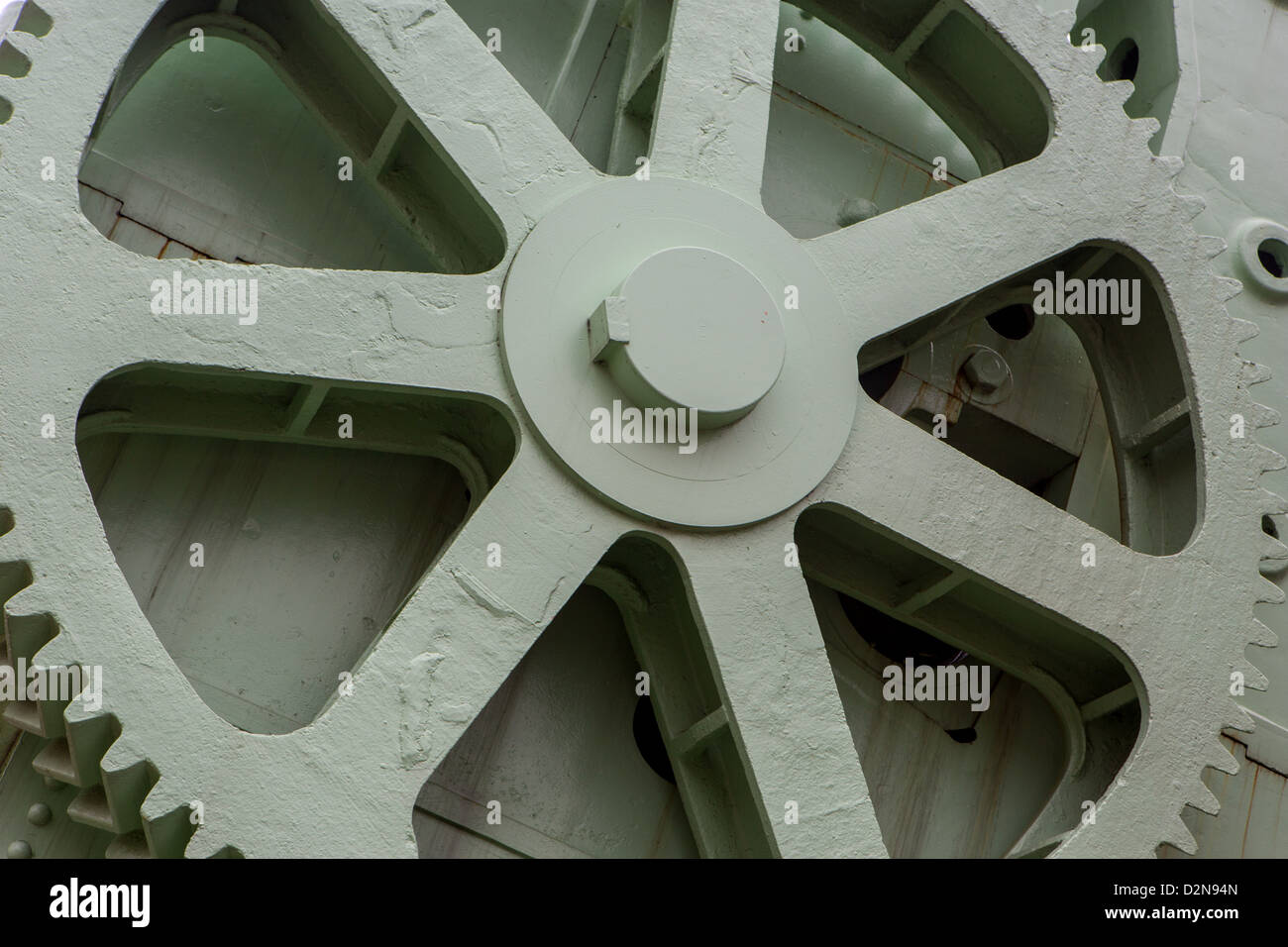 A large green cog wheel in a naval dockyard Stock Photo - Alamy