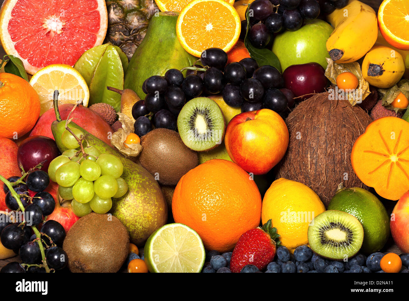 Background from many different exotic fruits Stock Photo - Alamy