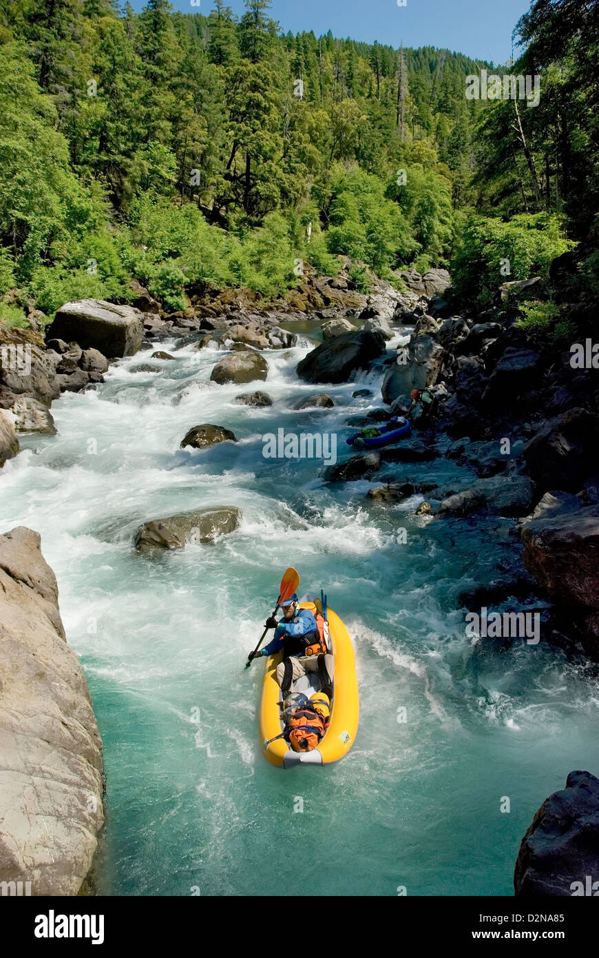 Paddling an inflatable kayak down Submarine Hole Rapid on the Illinois ...
