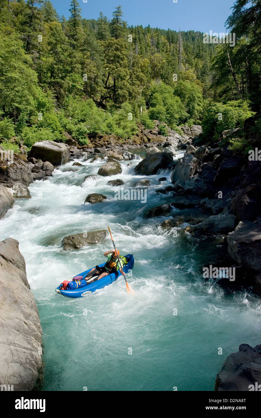 Paddling an inflatable kayak down Submarine Hole Rapid on the Illinois ...
