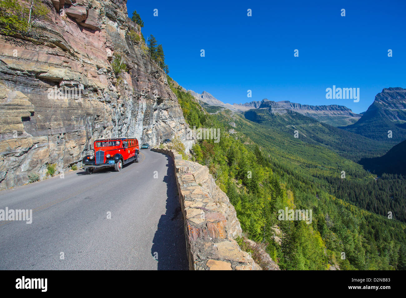 Red Bus on the Going to the Sun Road in Glacier National Park in the ...