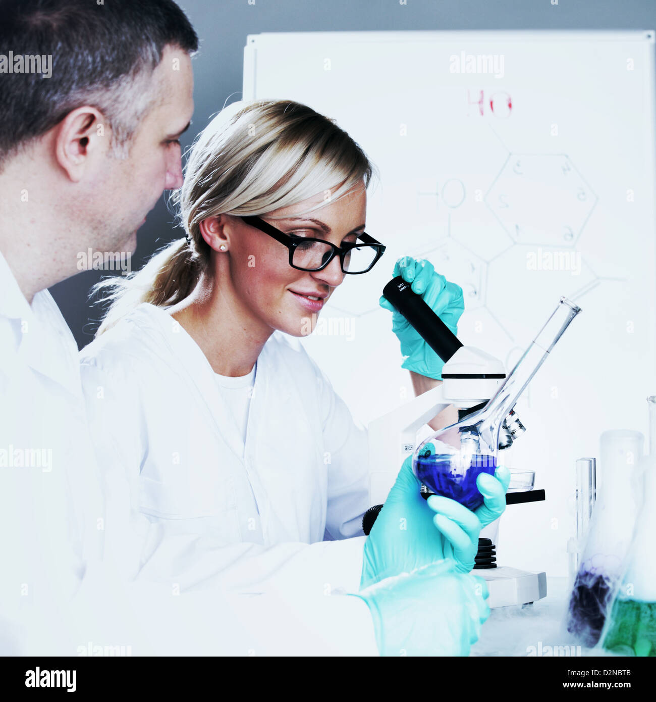 two scientist in chemical lab conducting experiments Stock Photo - Alamy