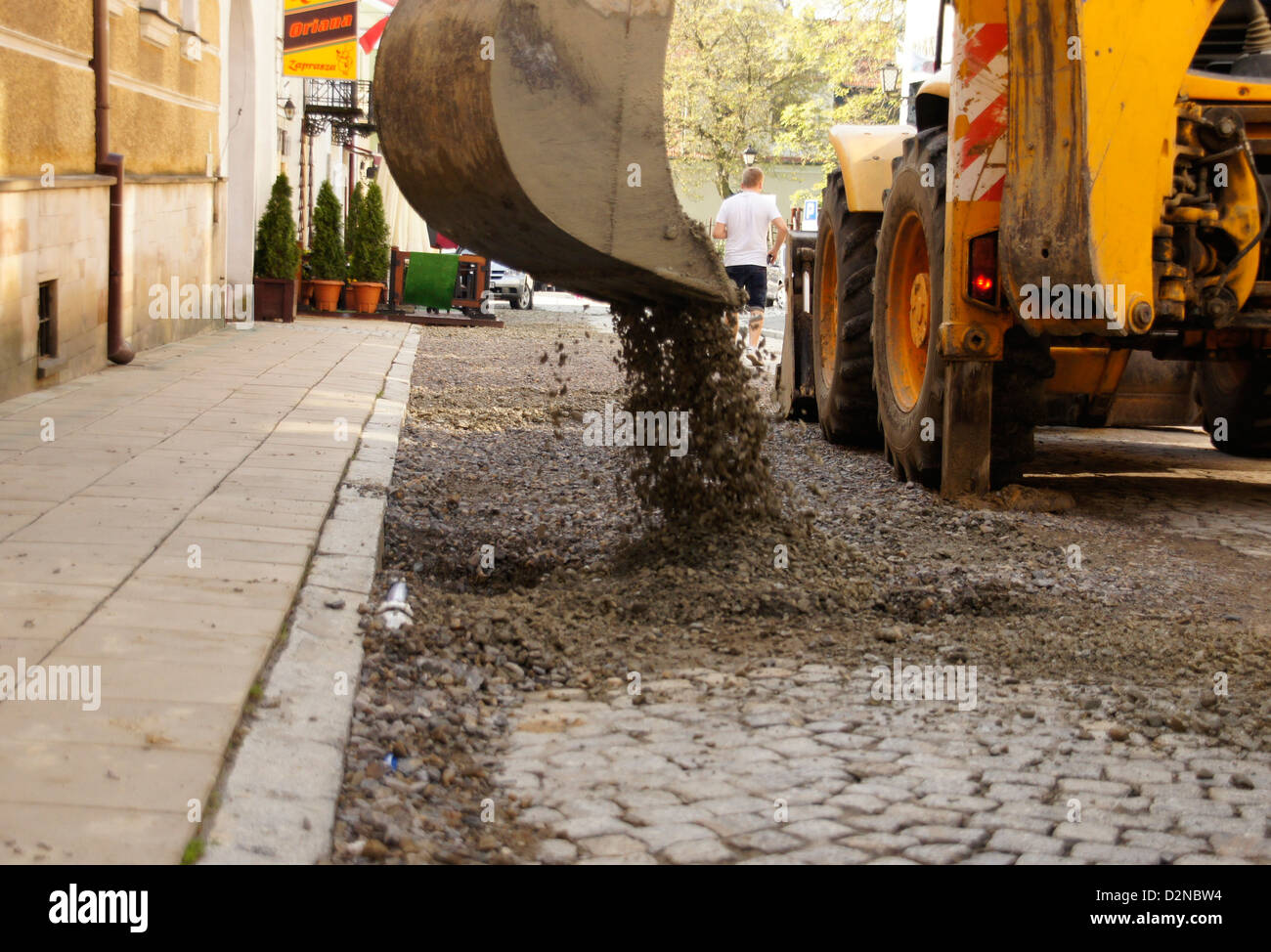 Yellow excavator road repair hi-res stock photography and images - Alamy