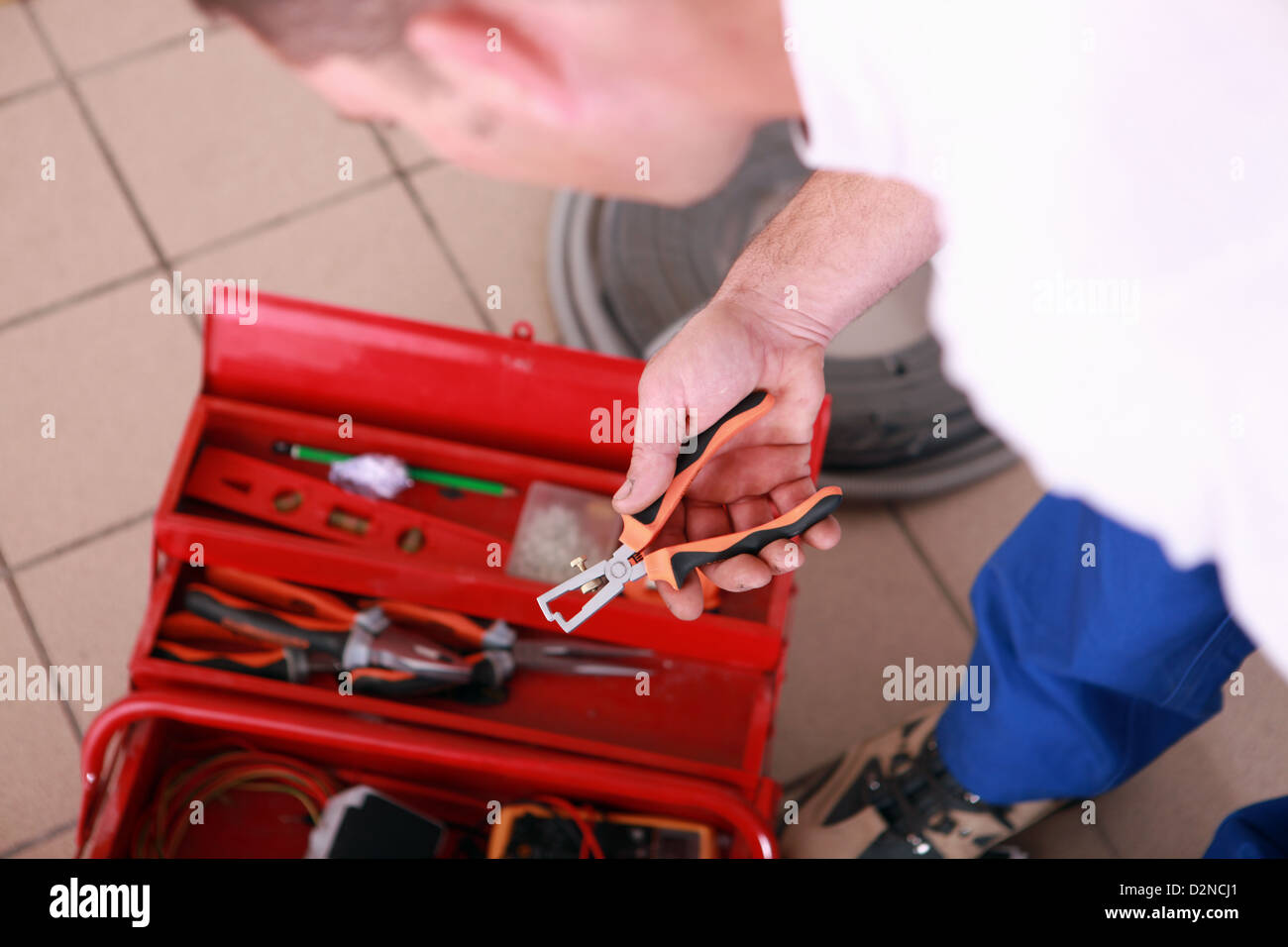 Handyman choosing the right tool Stock Photo - Alamy