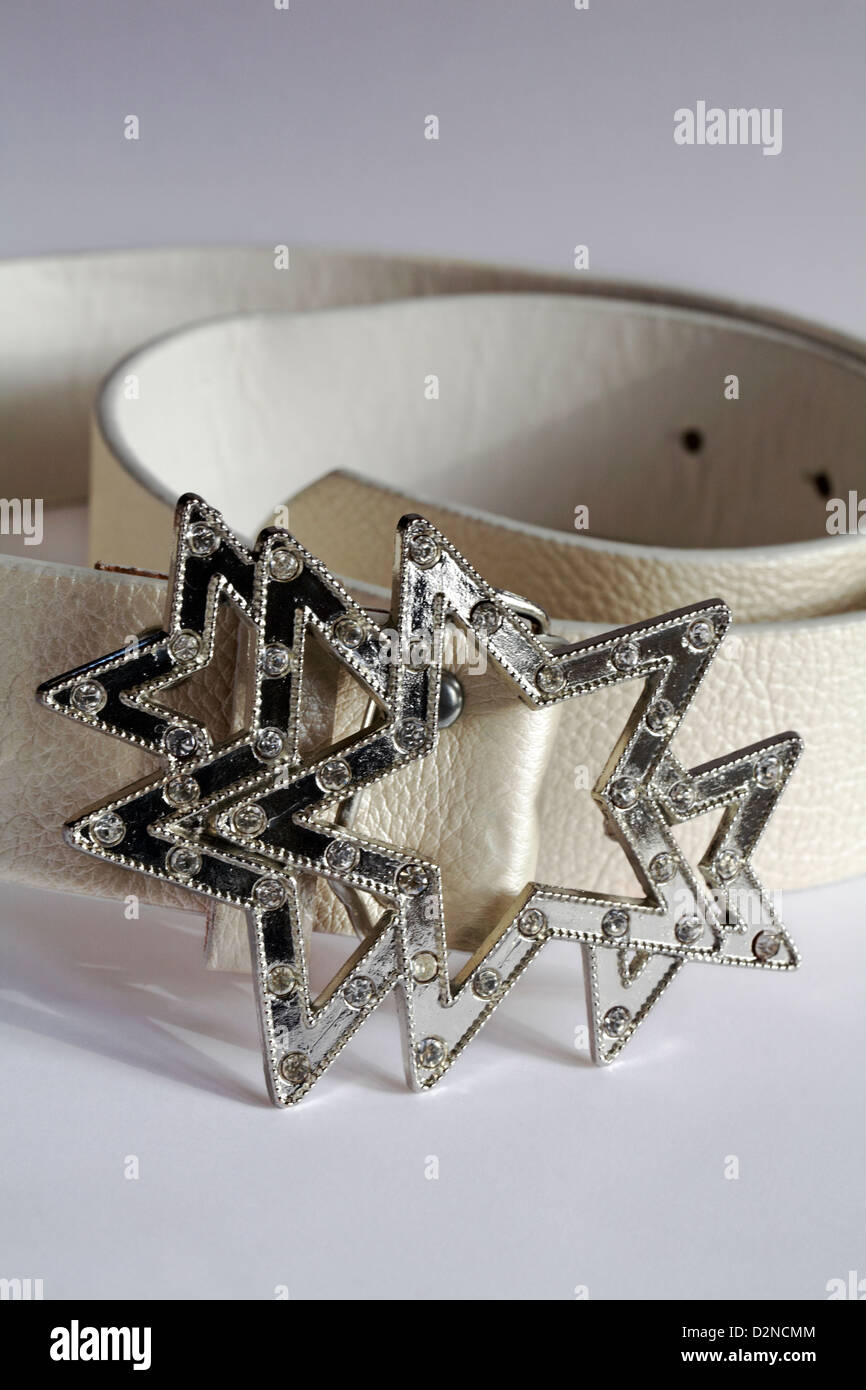 White belt with sparkling stars buckle set on white background Stock ...