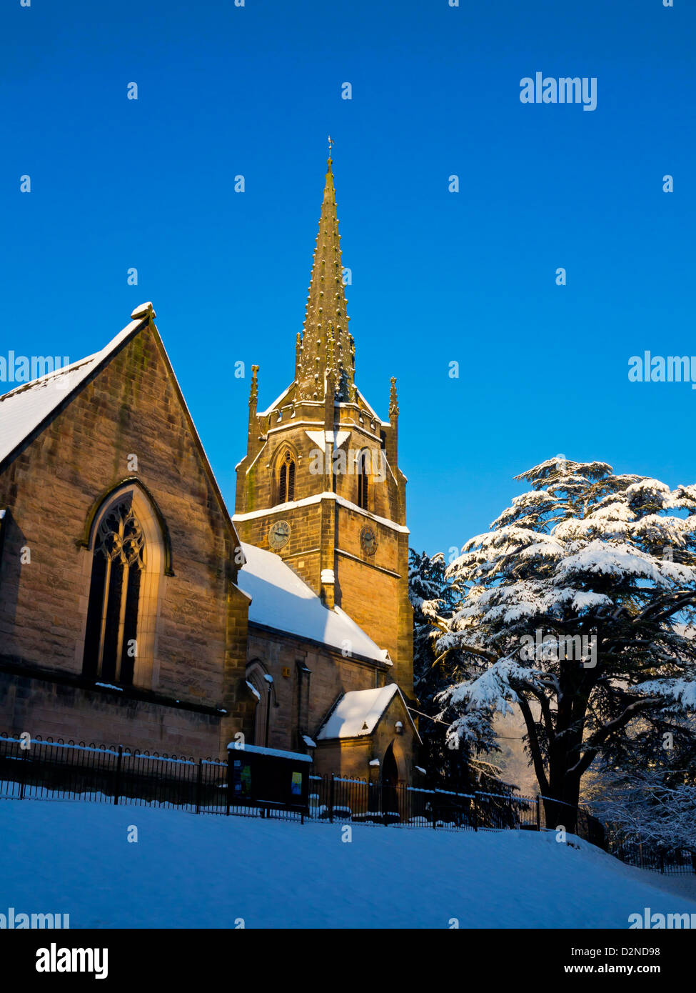 Winter scene with snow and blue sky at Holy Trinity Church in Matlock ...
