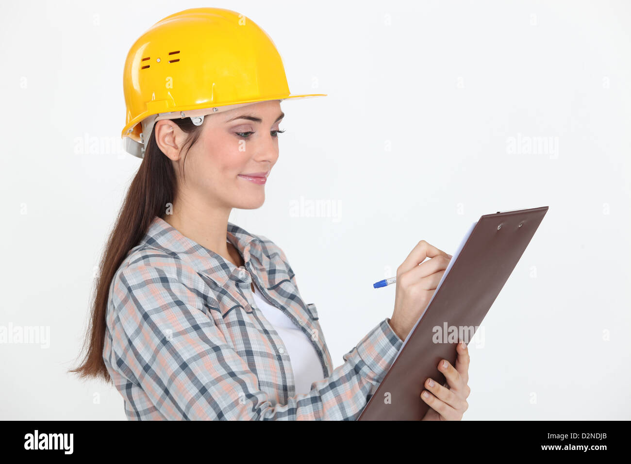 Construction worker with a clipboard Stock Photo - Alamy