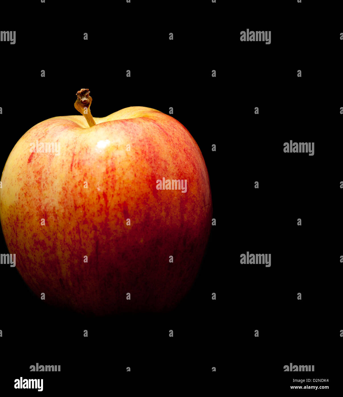 Red apple on black background Stock Photo - Alamy