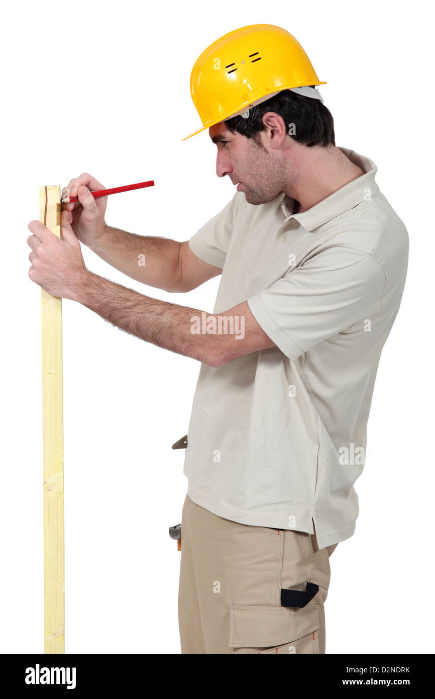 Man marking wood Stock Photo - Alamy