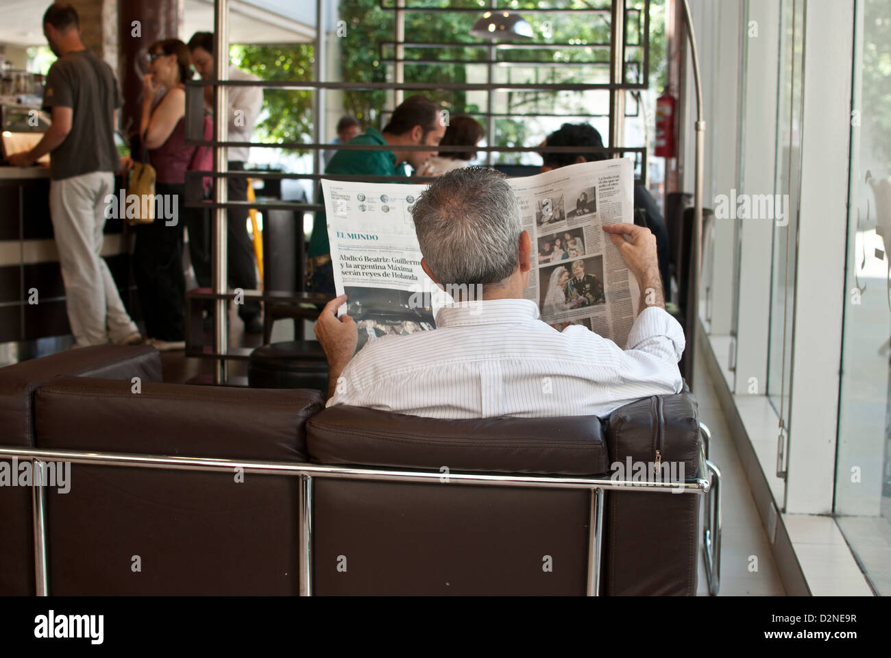 man reading the newspaper Stock Photo - Alamy