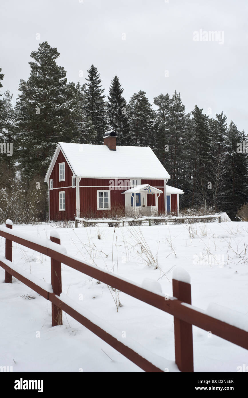 Small timber house painted in traditional red colour Stock Photo - Alamy