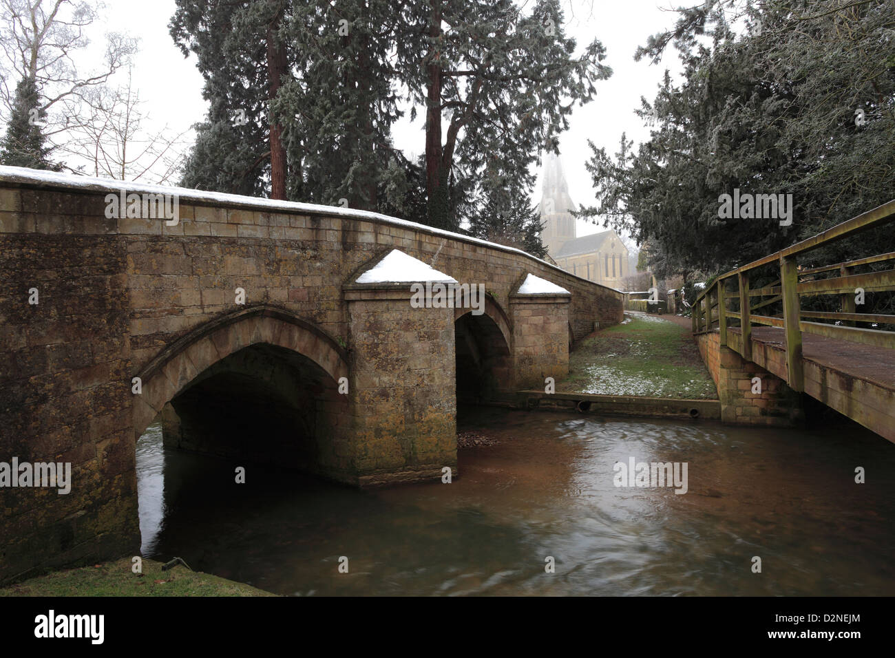 Winter snow, river Chater stone bridge, St Marys church, Ketton village ...