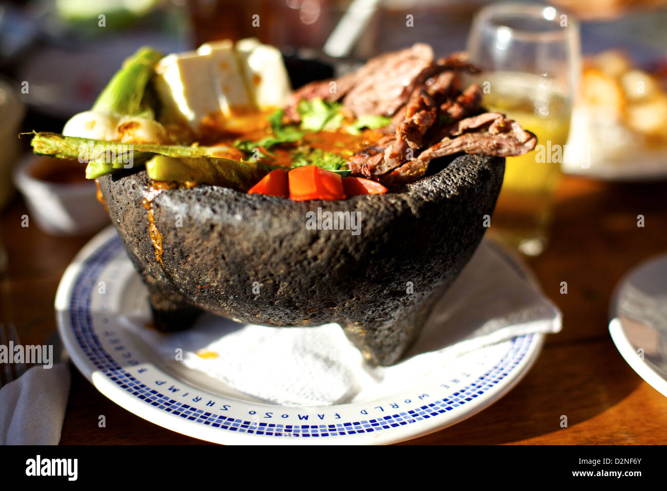 Molcajete meal with grilled steak, cheese, and vegetables in Mazatlan ...