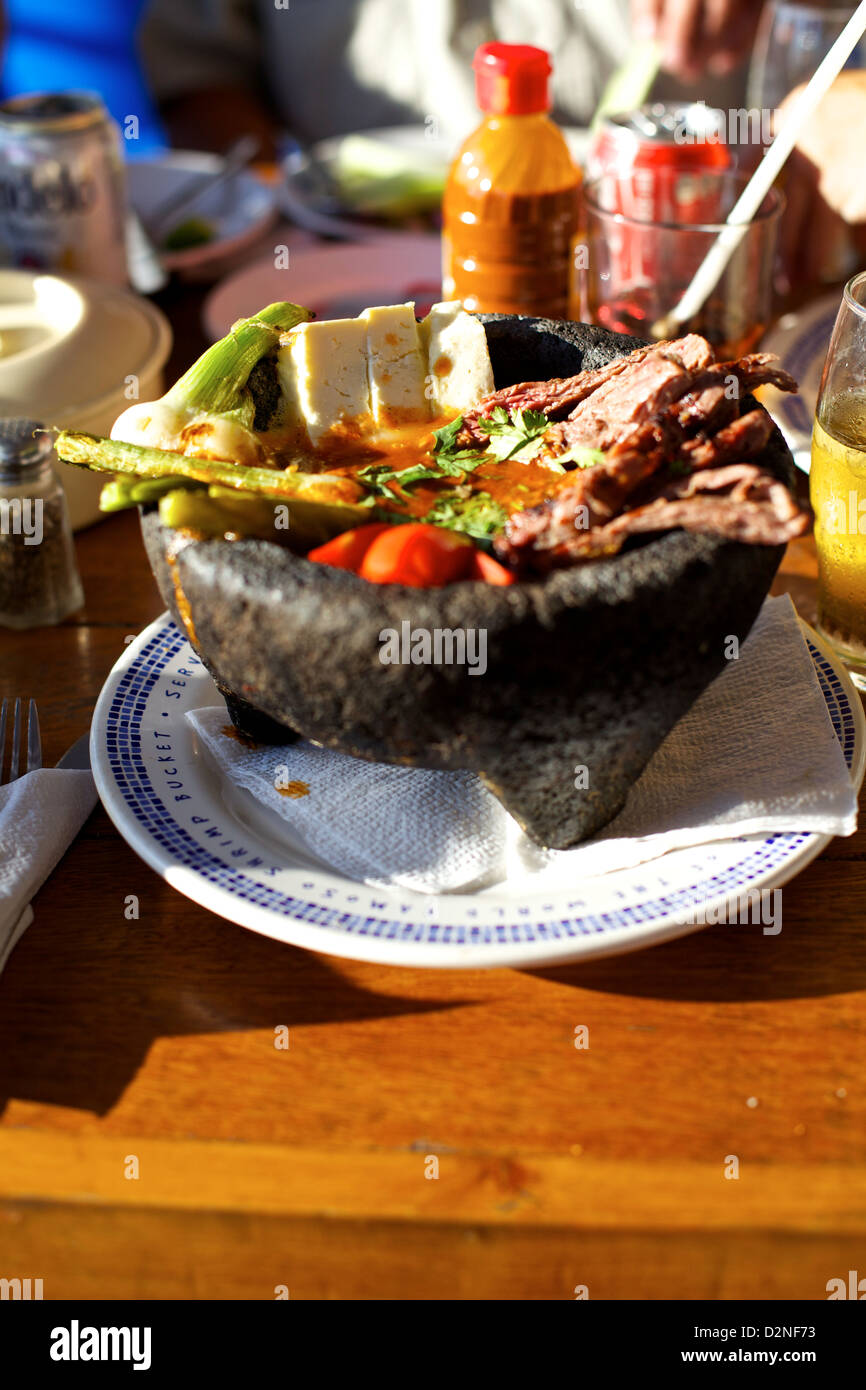 Molcajete meal with grilled steak, cheese, and vegetables in Mazatlan ...