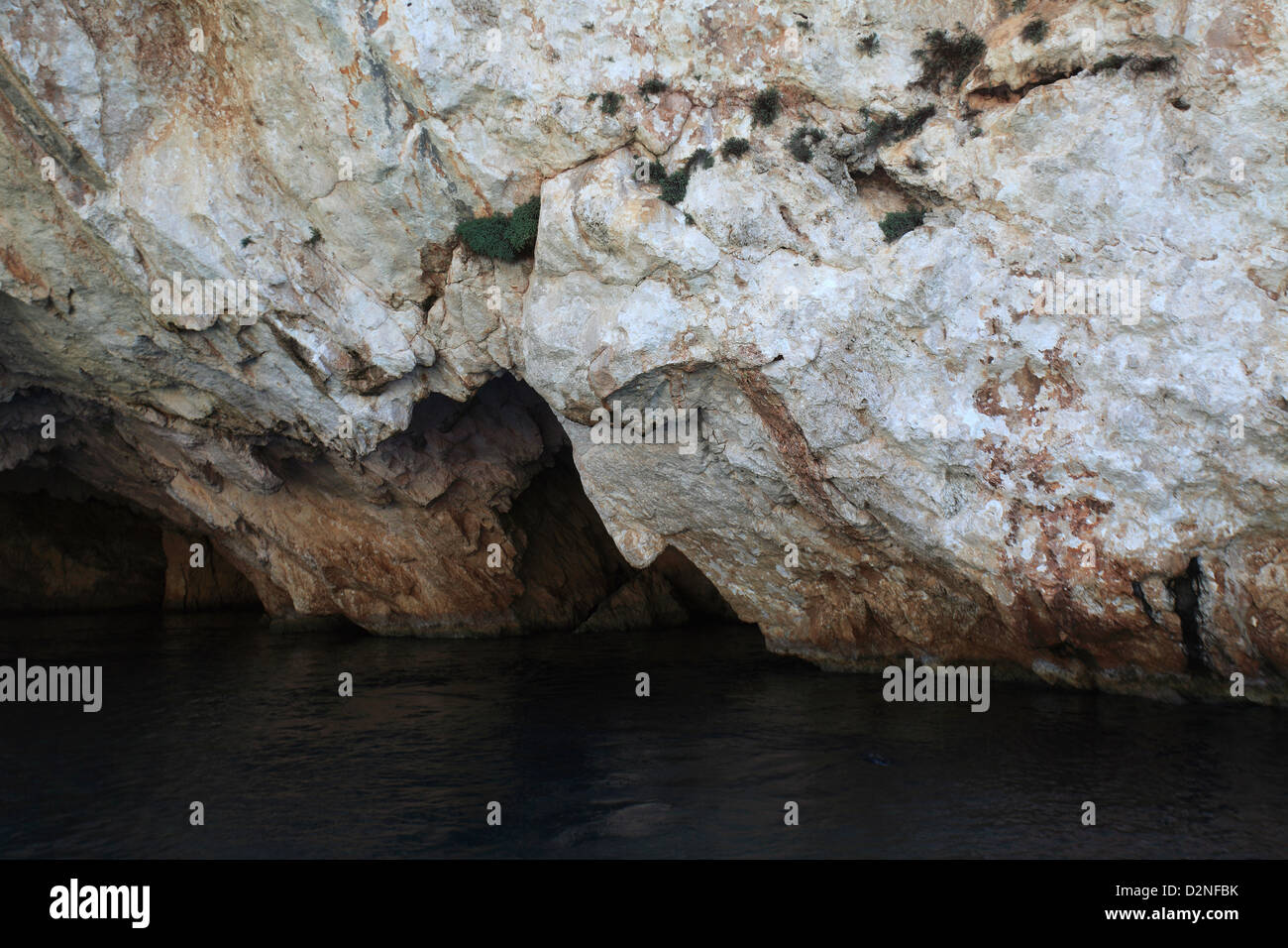 The “Face of Poseidon Rock” in the small harbour at Vromi resort ...