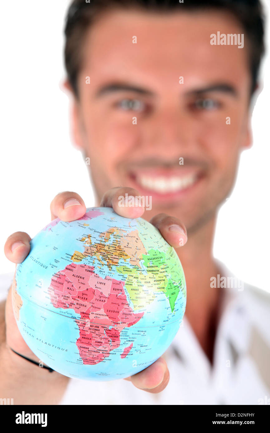 Man holding globe Stock Photo - Alamy