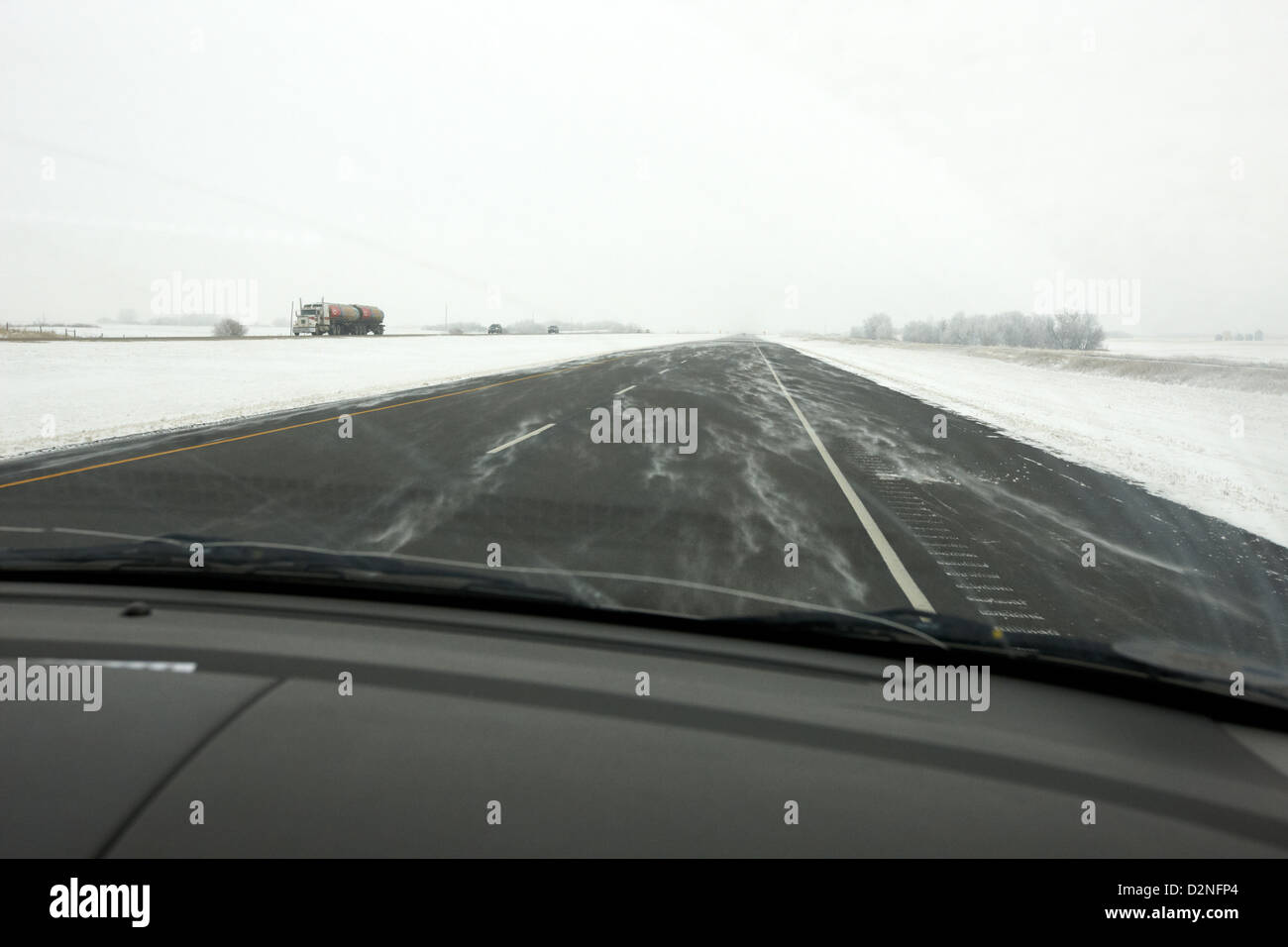 Snow blowing over road hi-res stock photography and images - Alamy