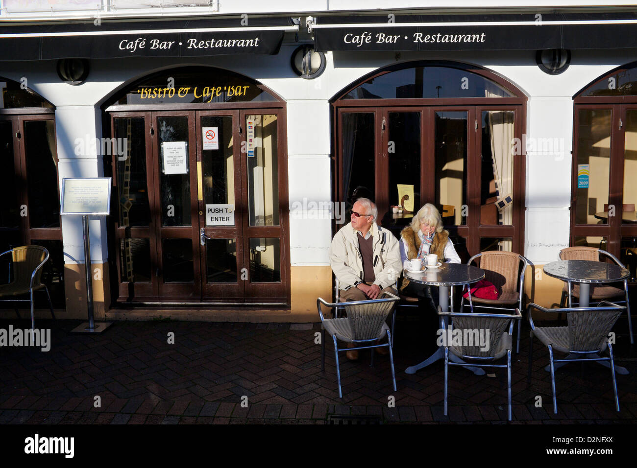 People sitting outside a restaurant, Poole Quay, Poole, Dorset, UK ...