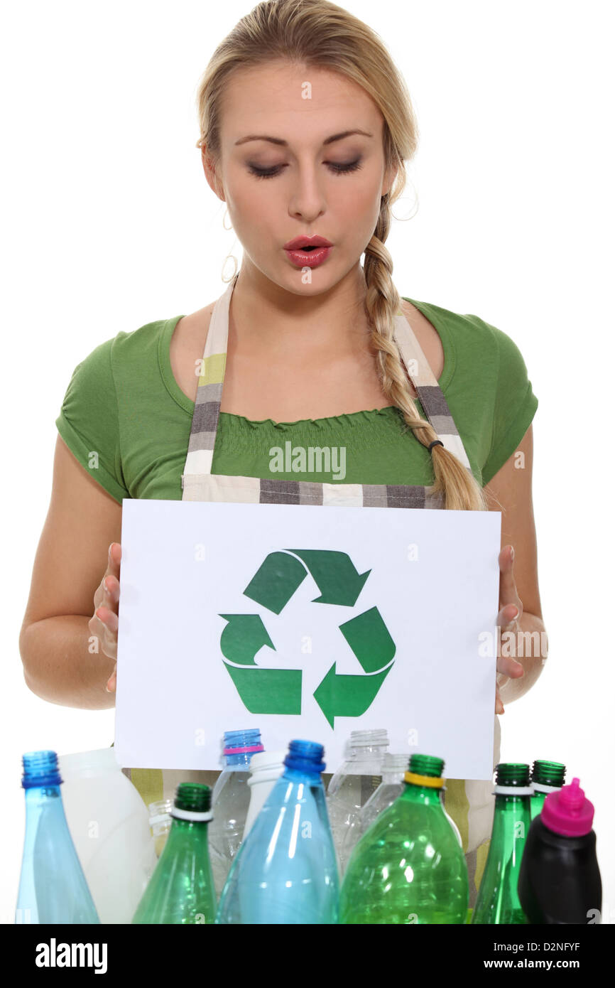 Young woman recycling bottles Stock Photo - Alamy