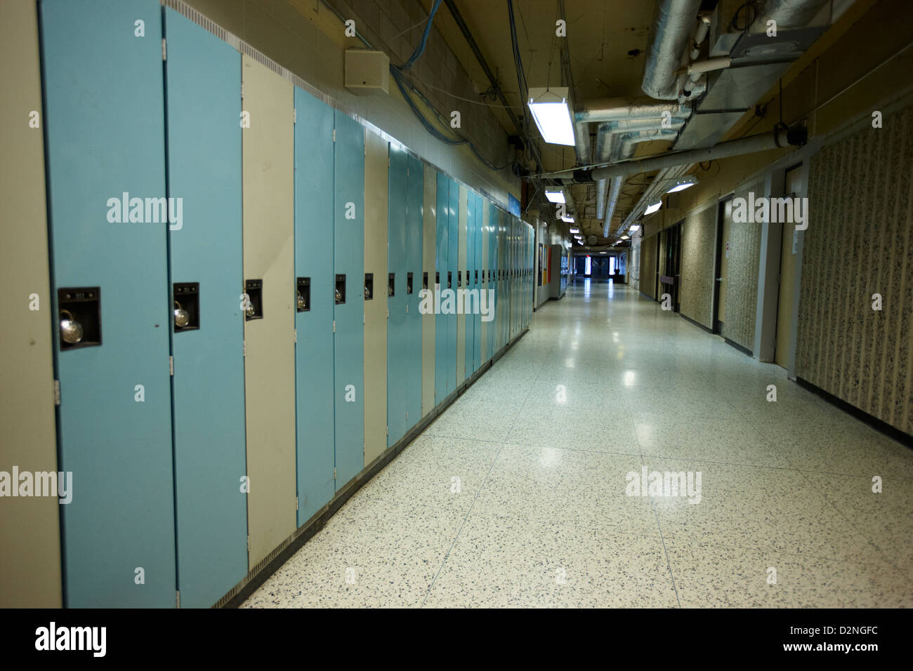 row of locked school lockers in empty corridor of High school canada ...