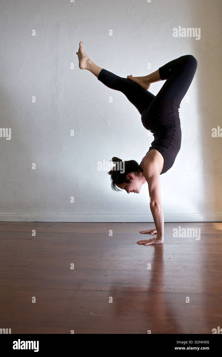 A yoga practitioner demonstrates strength, flexibility, and mindfulness ...