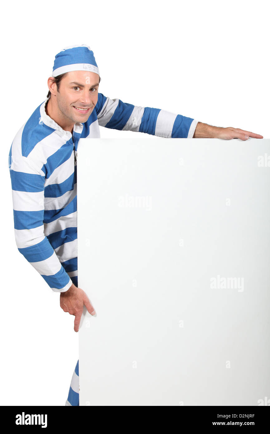Prisoner holding white board Stock Photo - Alamy