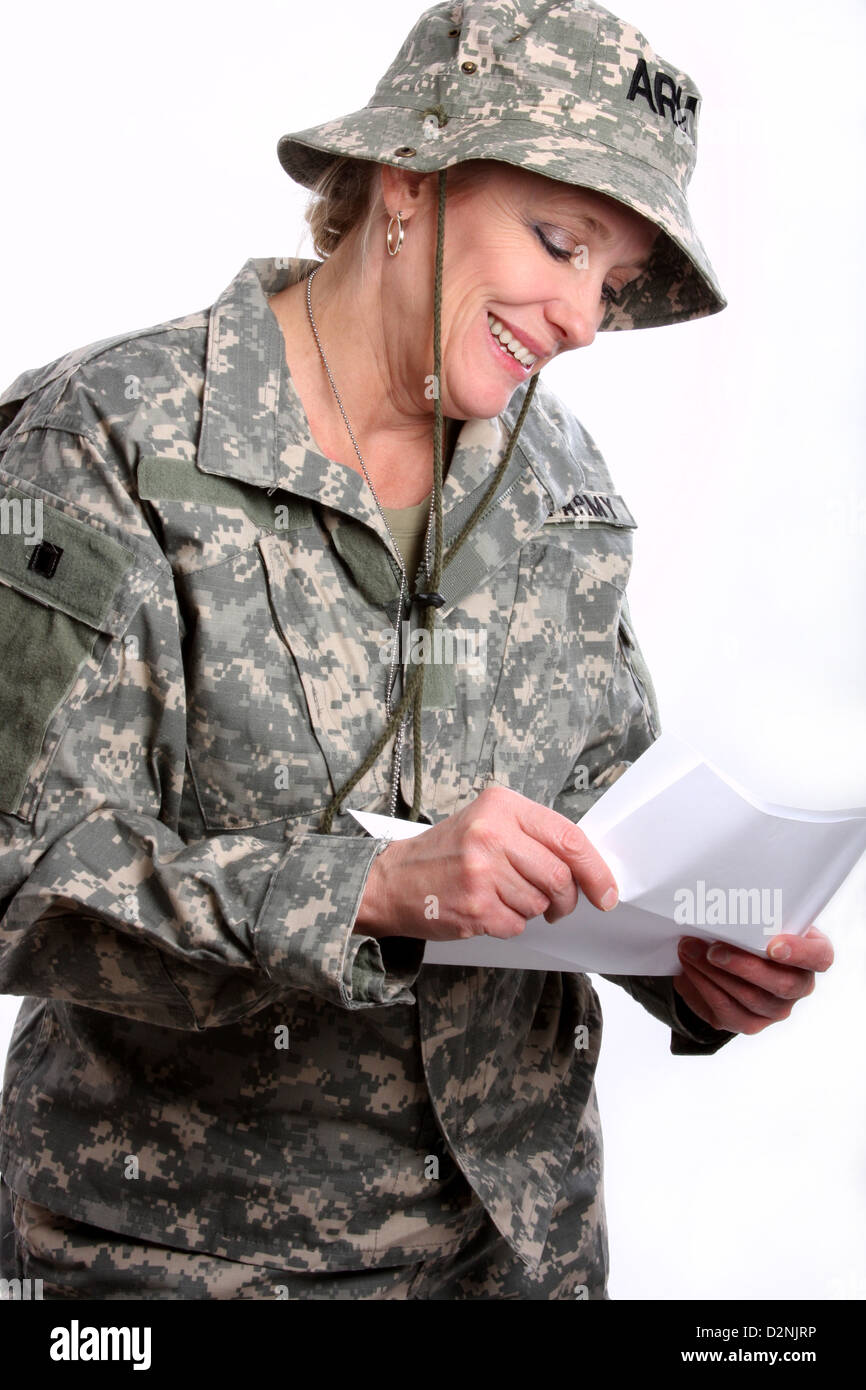 A happy USA military woman soldier reading a letter from home Stock ...