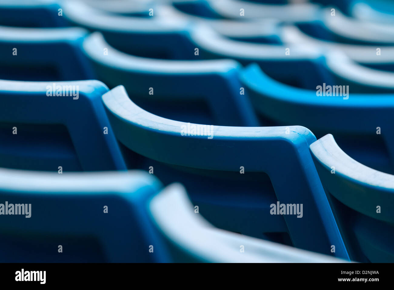 Seating rows in a stadium with weathered chairs Stock Photo - Alamy