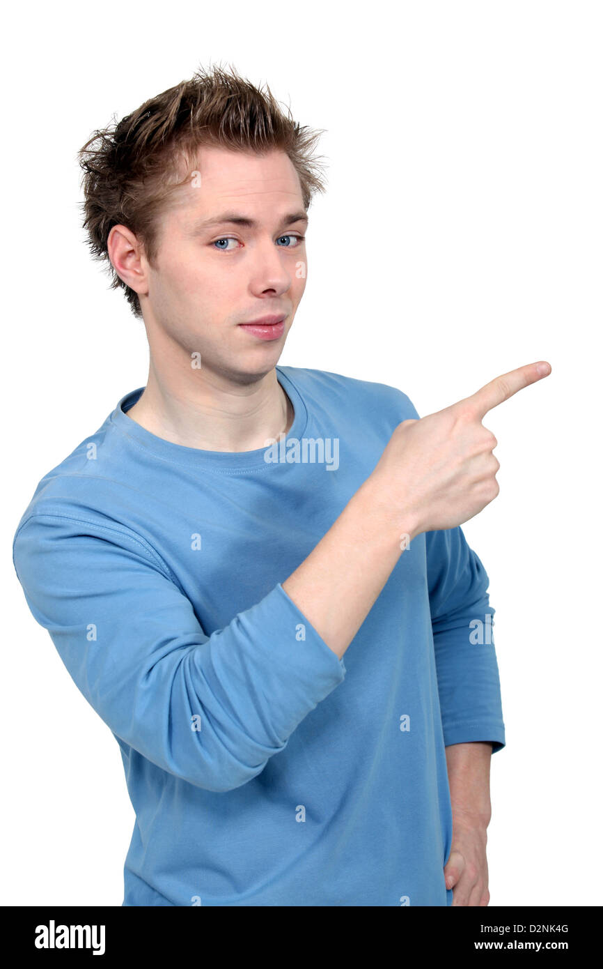 Young man pointing out the right direction Stock Photo - Alamy