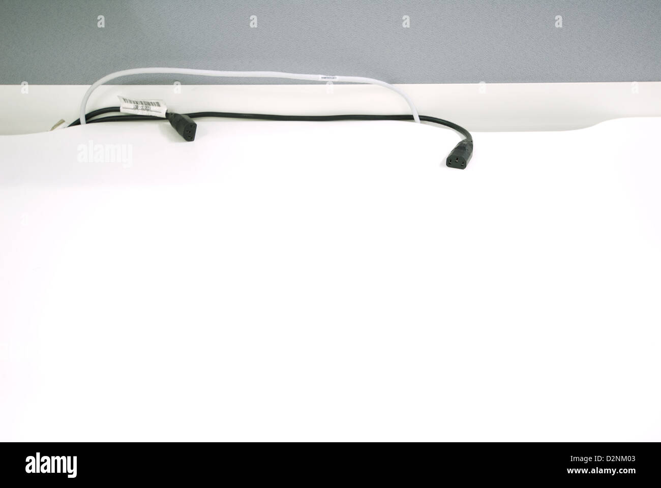 Computer power cables unplugged at empty white workstation Stock Photo ...