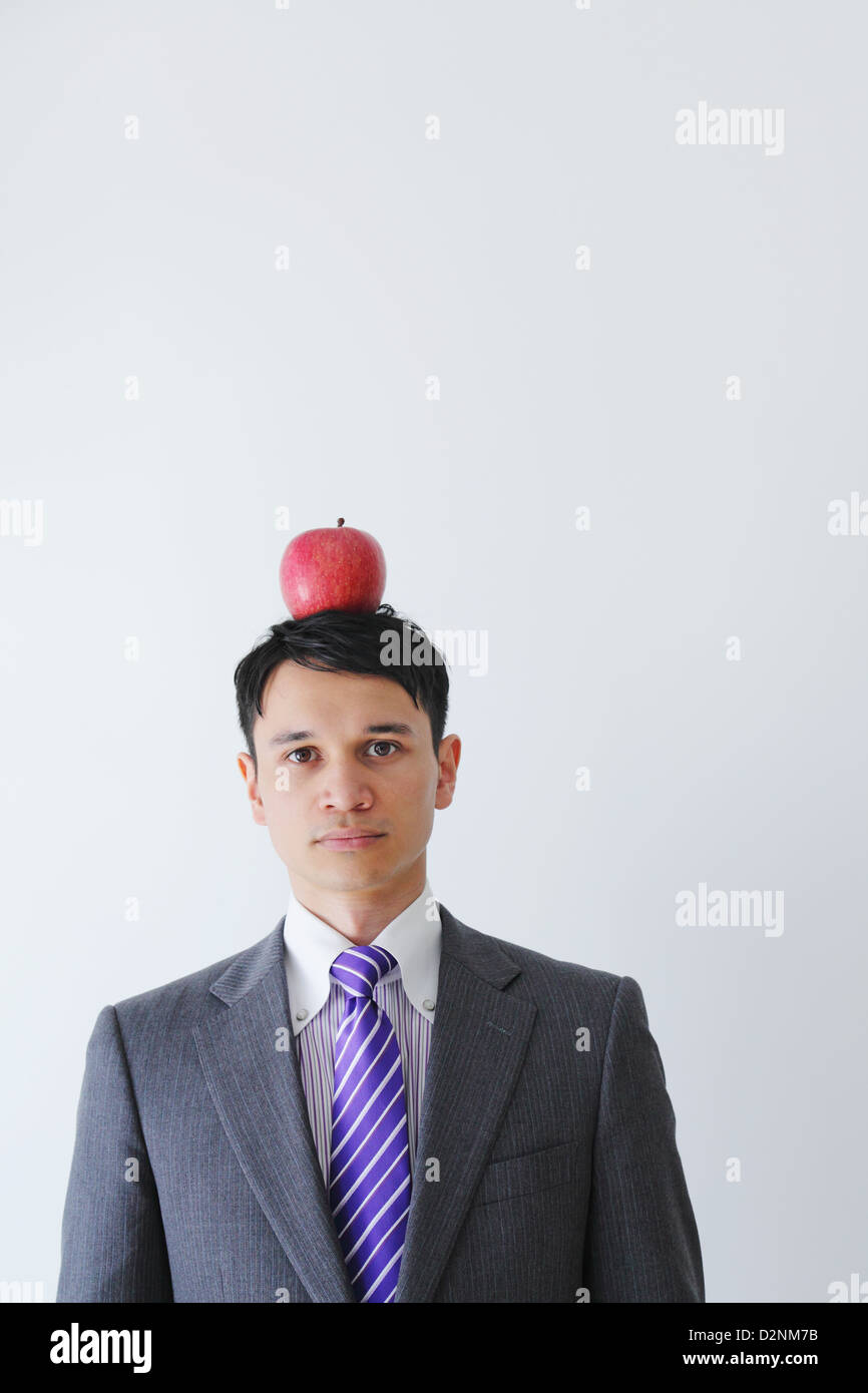 Businessman apple on head shot hi-res stock photography and images - Alamy