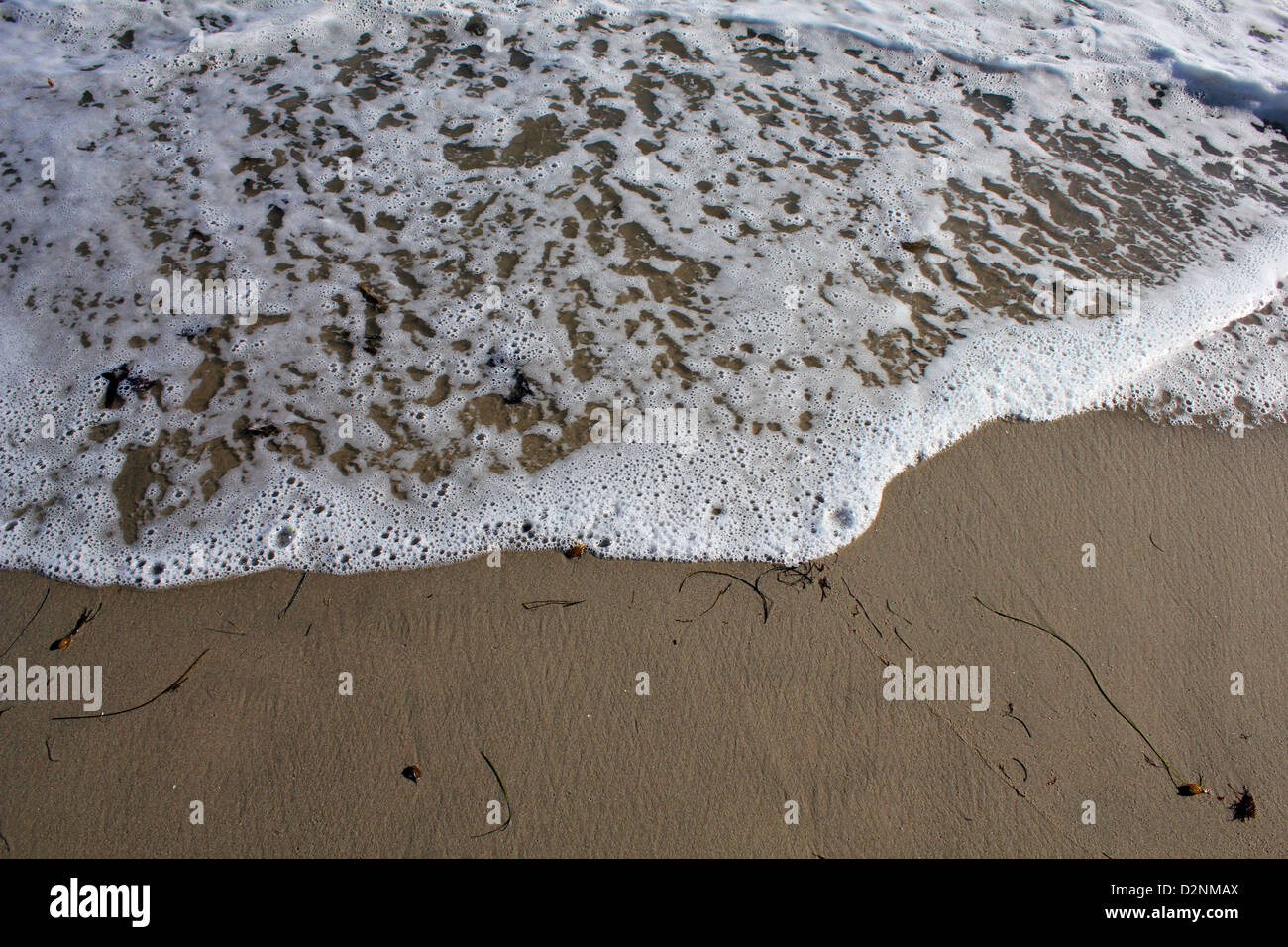 Tide on a Beach Stock Photo - Alamy