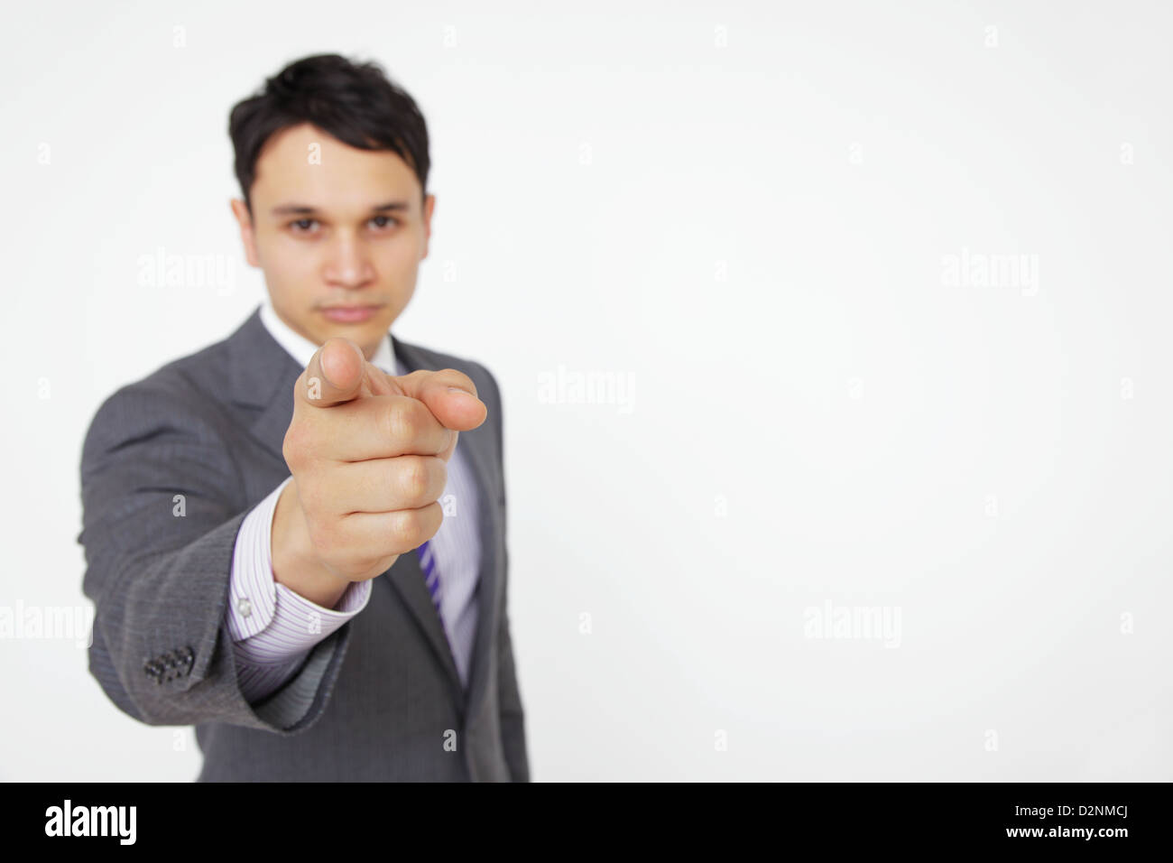 Businessman pointing a finger Stock Photo - Alamy