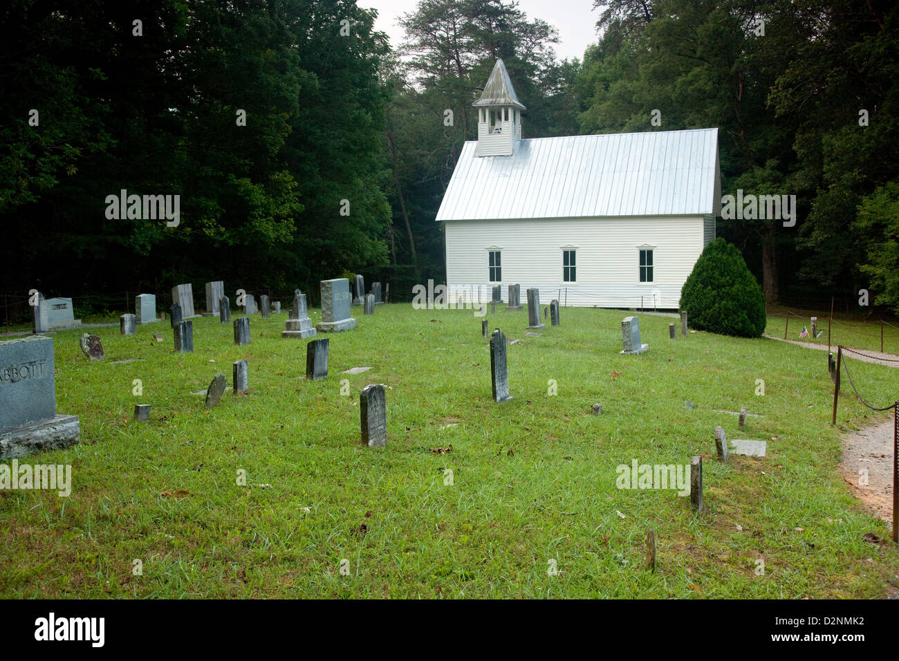 Little white country church, with its old graveyard and surrounded by ...